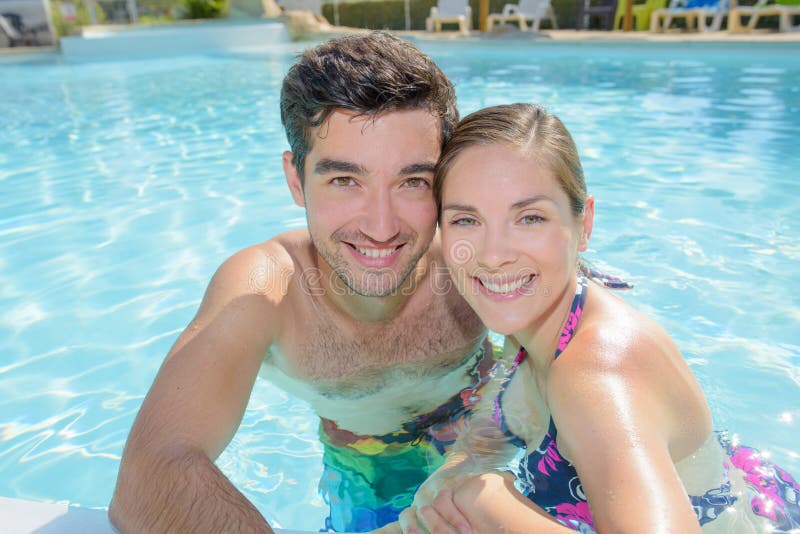Couple in the pool stock image. Image of friendship, swimming - 61839