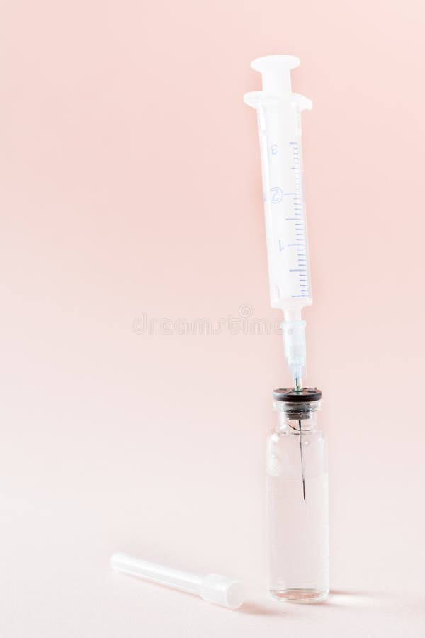 Vaccination and Immunization. Syringe Needle Inserted into a Glass Vial ...