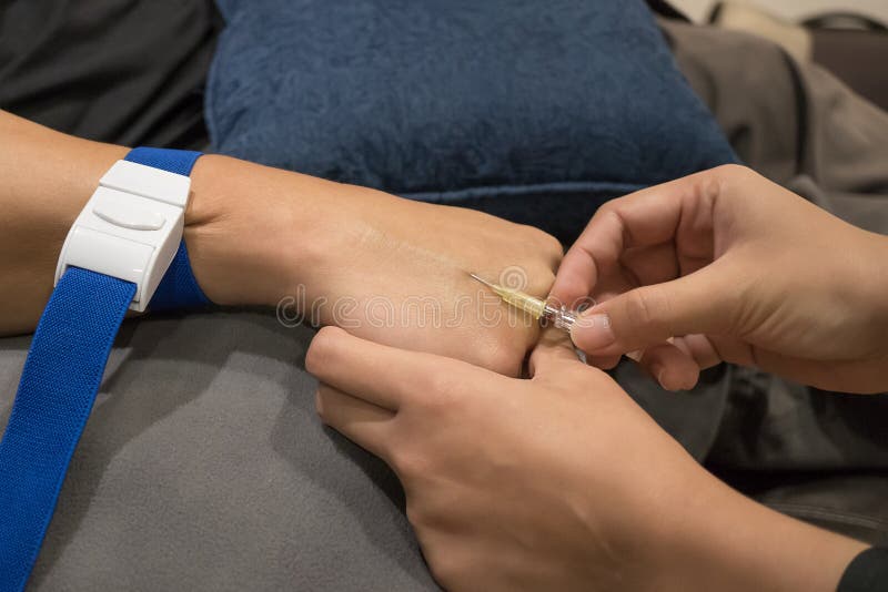 Vaccine injection in hand stock image. Image of control - 82264363