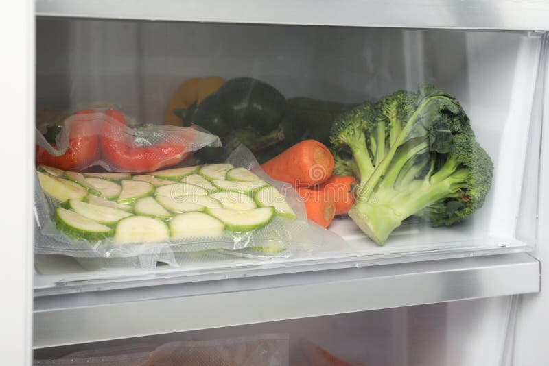 Vacuum Bags with Different Products in Fridge. Food Storage Stock Photo ...