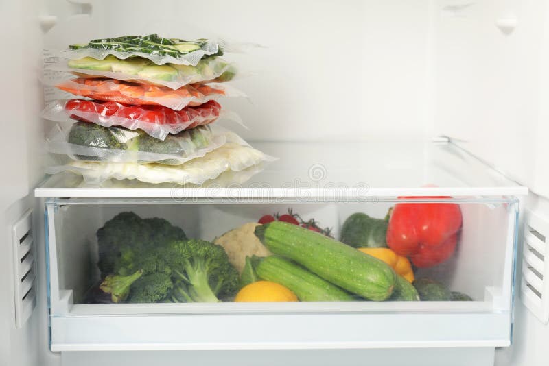 Vacuum Bags with Different Vegetables in Fridge, Space for Text. Food ...