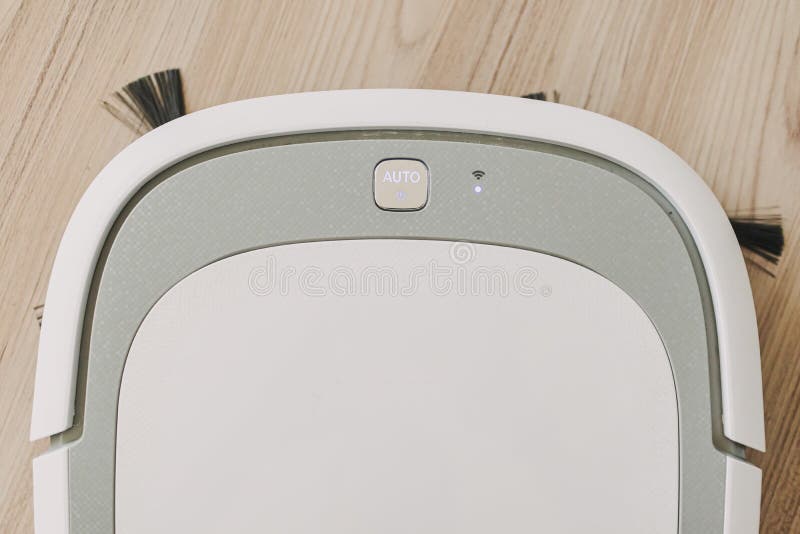 Vacuum Cleaner Bot is Working on the Floor of the Apartment. Stock ...