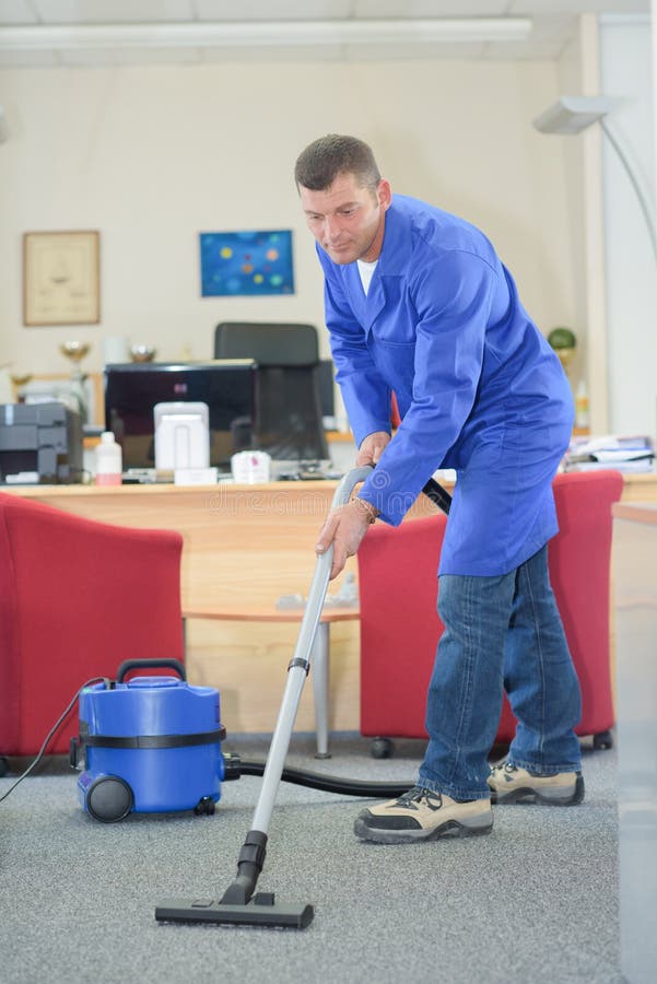 Vacuum cleaning in office stock photo. Image of staff - 88462306