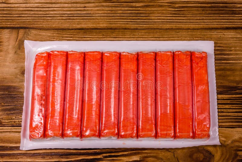 Vacuum Pack of Crab Sticks on a Wooden Table. Top View Stock Image ...
