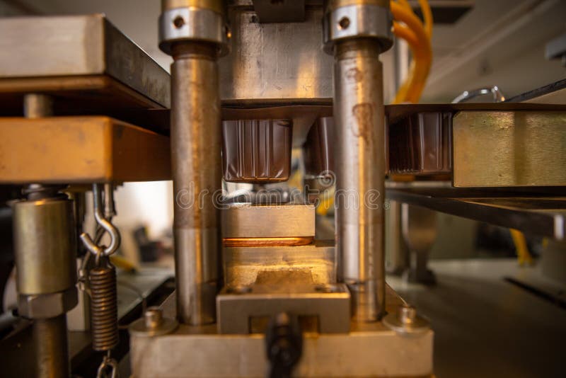 Vacuum Press for Shaping Plastic Packaging and a Box that Has Just Been ...