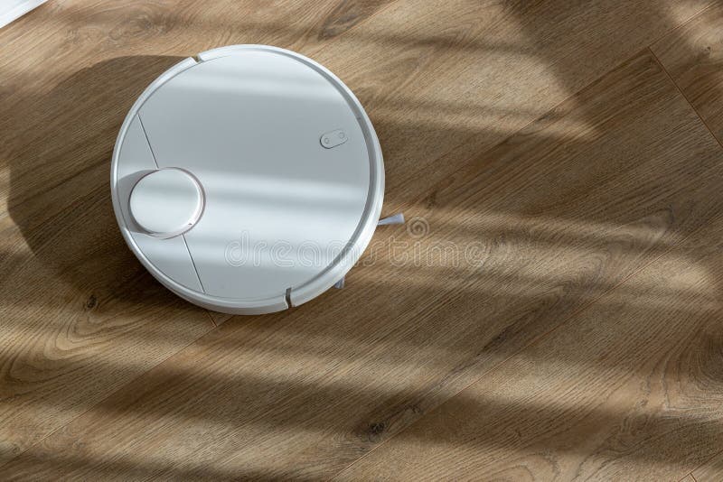 Vacuum Robot Cleaning at Home. Robot Vacuum Cleaner in the Modern Home ...