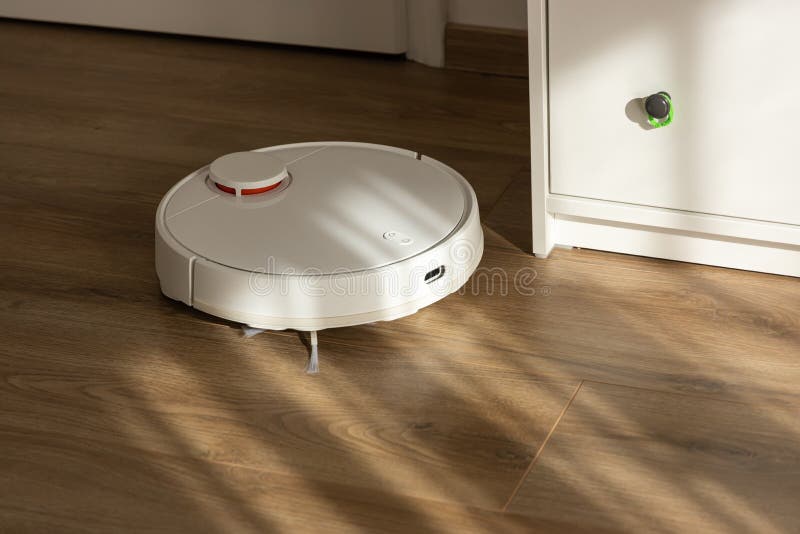 Vacuum Robot Cleaning at Home. Robot Vacuum Cleaner in the Modern Home ...