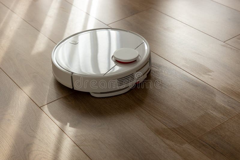 Vacuum Robot Cleaning at Home. Robot Vacuum Cleaner in the Modern Home ...