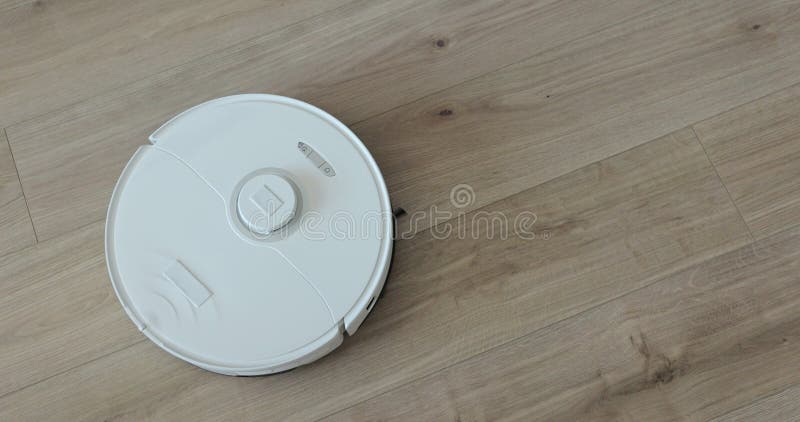 Vacuum Robot Cleaning at Home. Robot Vacuum Cleaner in the Modern Home ...