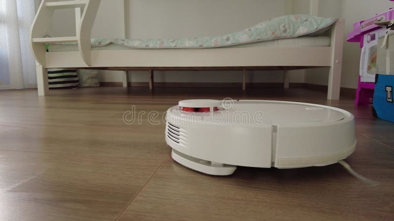Vacuum Robot Cleaning at Home. Robot Vacuum Cleaner in the Modern Home ...
