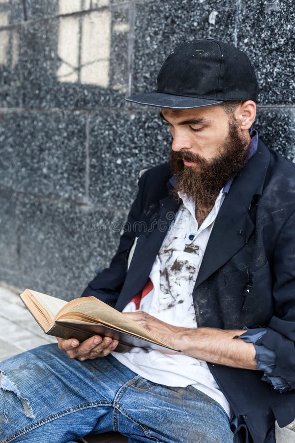 Homeless Man Reading Public Newspaper on the Stair of the Walkway ...