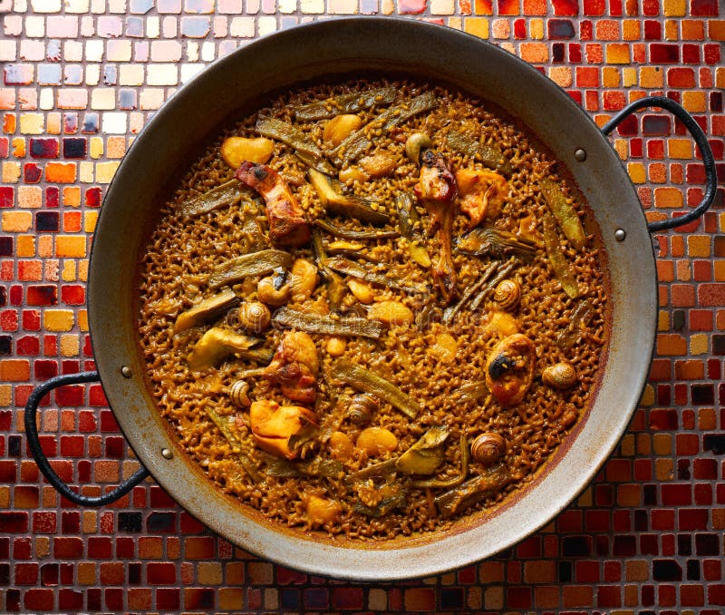 Valencian Paella with Chicken and Rabbit Stock Photo - Image of paella ...