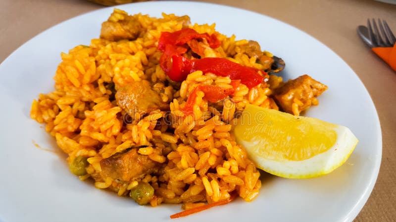 Valencian Rice Dish, Seafood Paella Being Cooked In A Large Shallow Pan ...