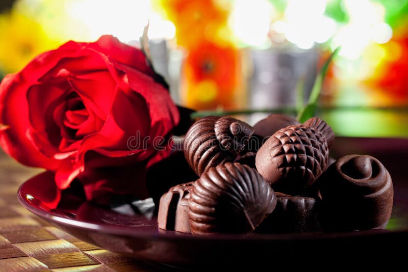 Red roses and chocolate stock photo. Image of flower - 102922024