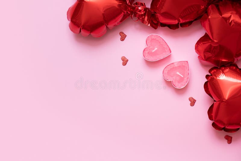 Valentines Day Background With Copy Space And Two Candels With Red Heart Shape Balloons On Pink