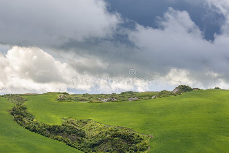 Valley with Fields on the Hillside in a Beautiful Landscape with Storm ...