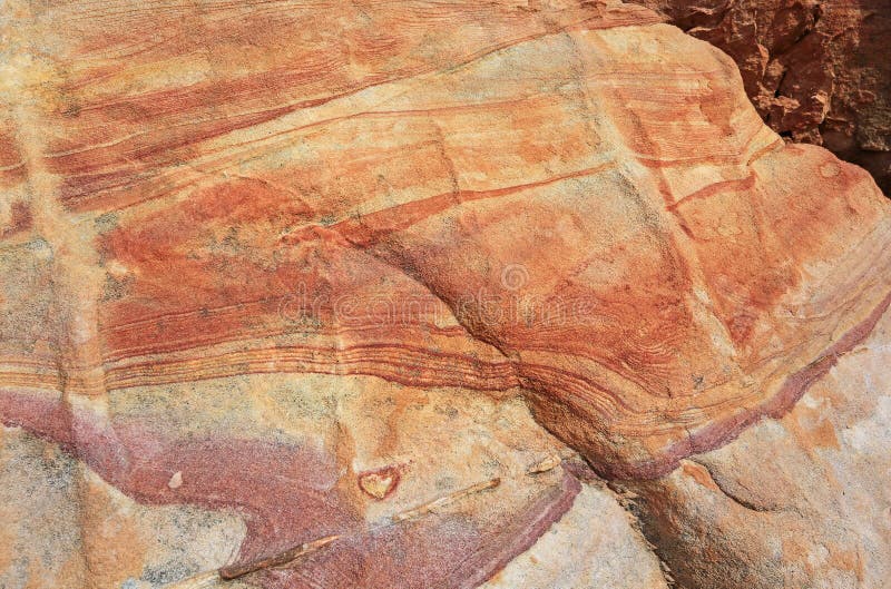 Orange red striped rock stock photo. Image of stone - 125196446