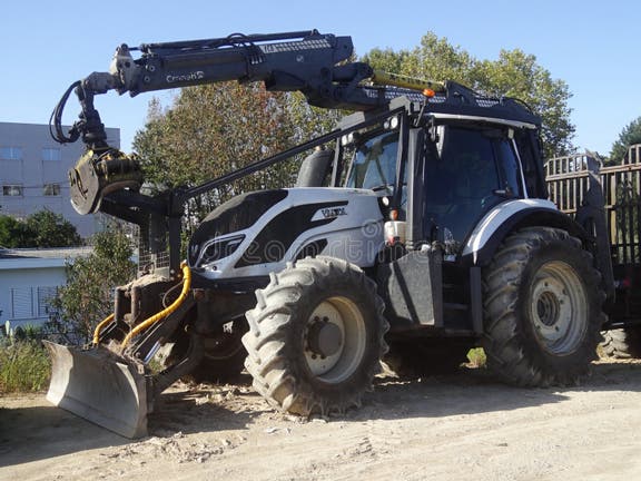 Valtra Forestry Tractor Equipped with a Cranab Crane and a Front Blade ...