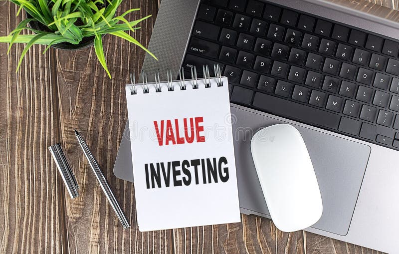 VALUE INVESTING Text on a Notebook with Laptop, Mouse and Pen . Stock ...