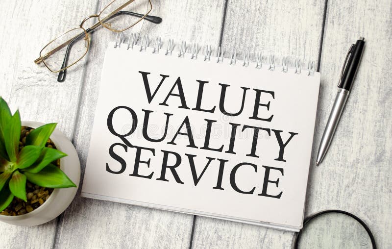 Value Quality Service Words on Notepad and Pen, Calculator and Glasses ...
