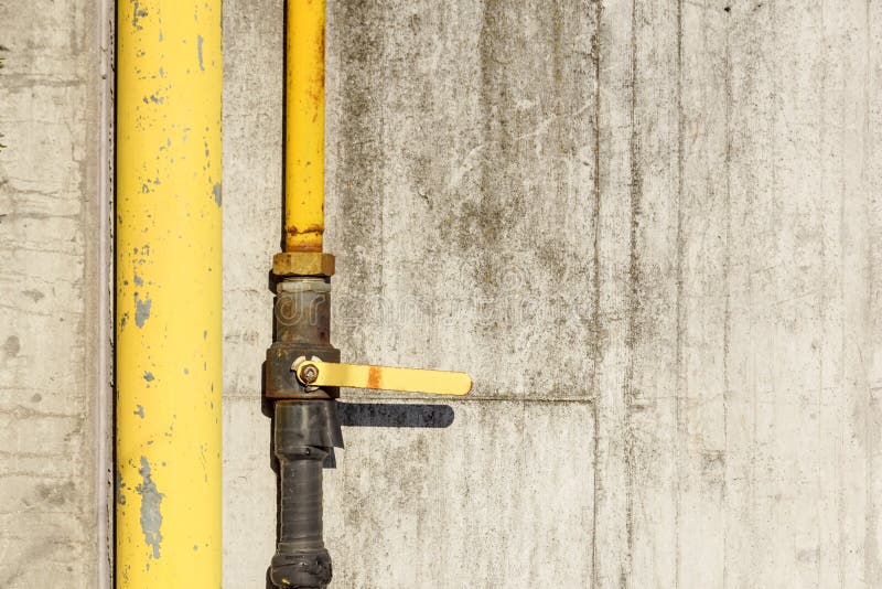 Yellow Gas Pipe in Front of Residential Building Wall Stock Photo ...