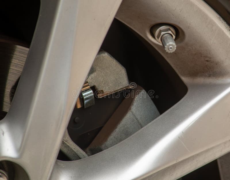A Valve Stem with a Grey Plastic Cap on a Car Wheel Stock Photo - Image ...