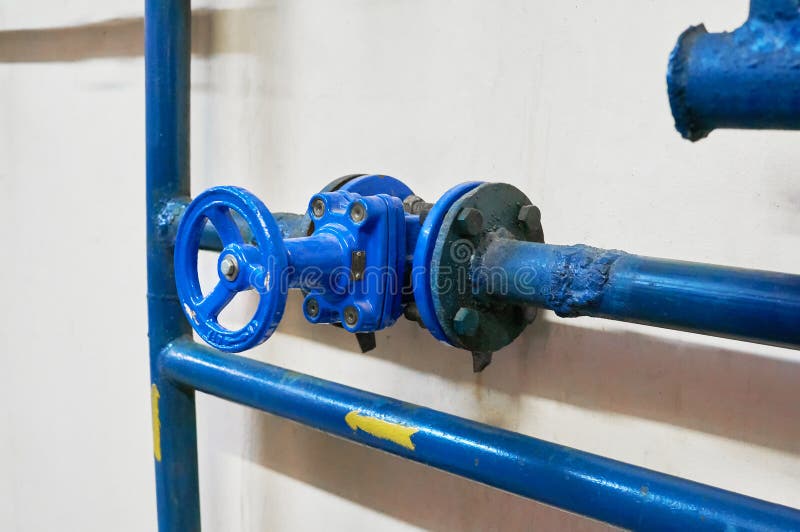 Valves Installed on Tubes Painted Blue. Industrial Background. Stock ...