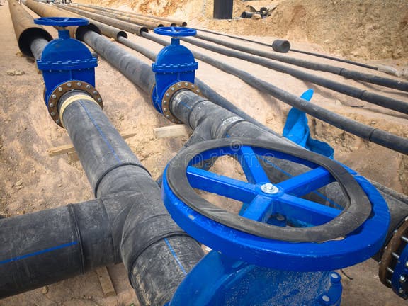 Valves on Pipeline in Ground. Pipe Valves in Trench Stock Image - Image ...