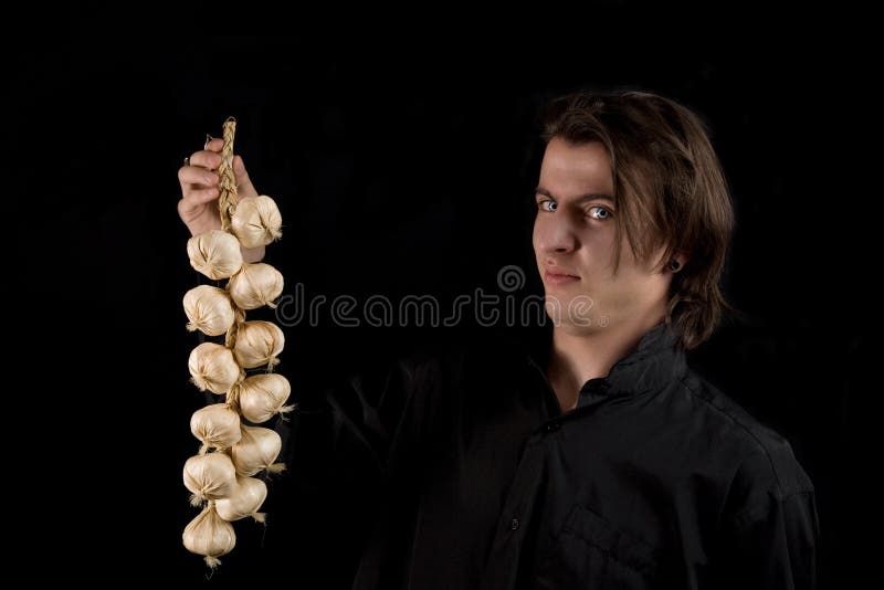 Vampire with Scary Eyes is Licking Garlic Stock Image - Image of ...