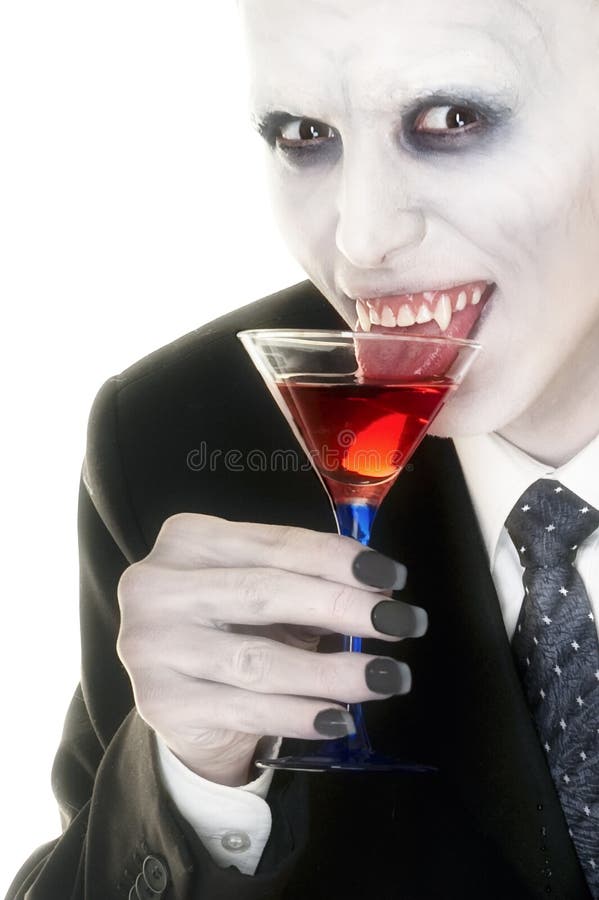 Vampire enjoying his drink stock image. Image of liquid - 14093897