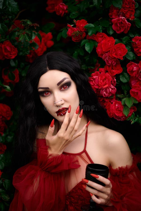 Vampire Girl on a Background of Red Roses Stock Photo - Image of black ...