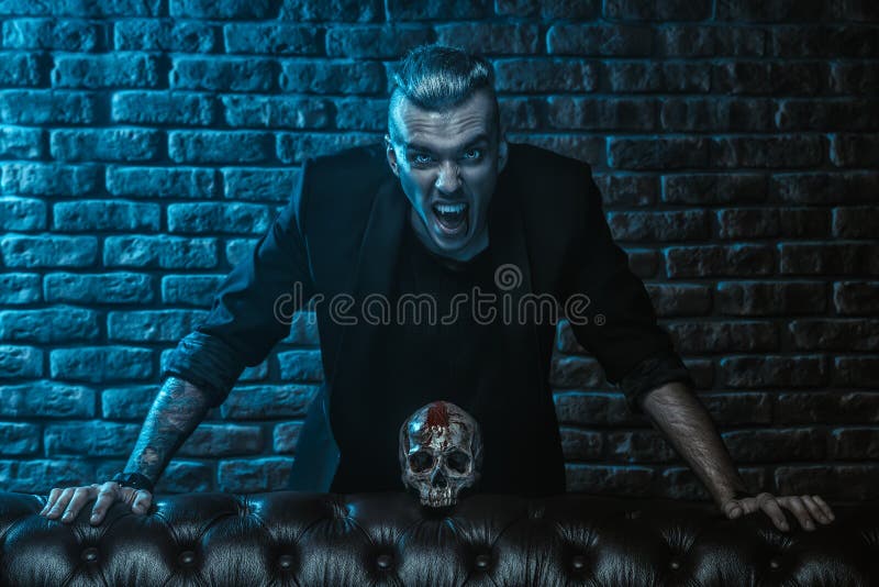 Shouting Vampire with Skull Stock Image - Image of hairstyle, light ...