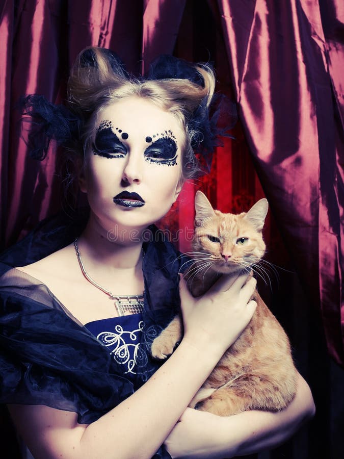 Young lady with cat. stock image. Image of devil, mysterious - 53744547