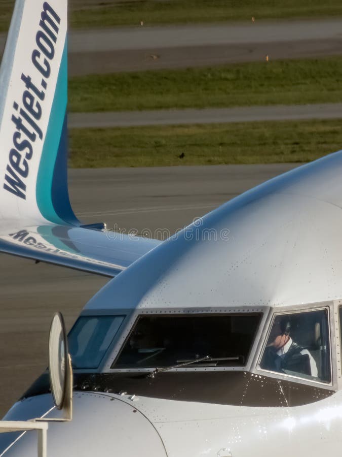 A Vertical View of a Westjet Plane with the Pilot Inside Editorial ...