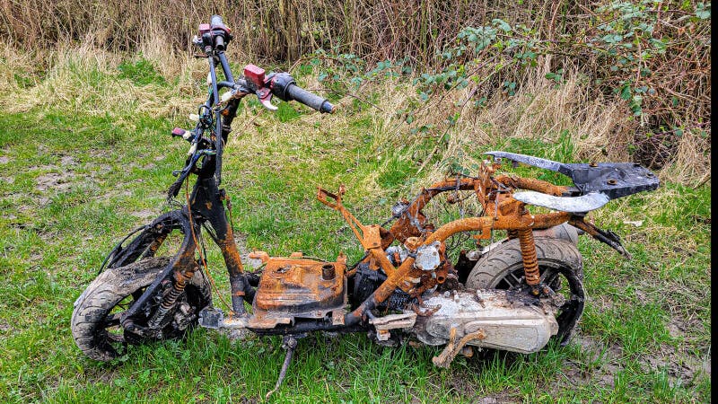 Vandalized Burned Bike on a Field in the UK Stock Photo - Image of ...