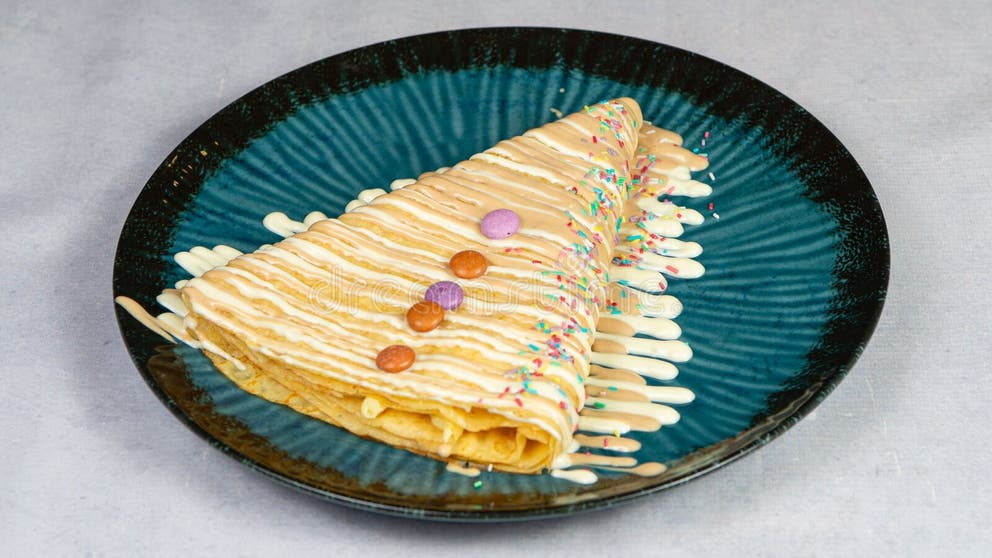 Vanilla crepe on a plate stock photo. Image of dessert - 255756824