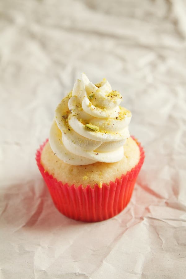 Vanilla Cupcake with Pistachio Sprinkles Stock Photo - Image of ...