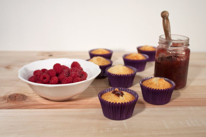 Vanilla Cupcakes Filled with Jam and Raspberry Stock Image - Image of ...