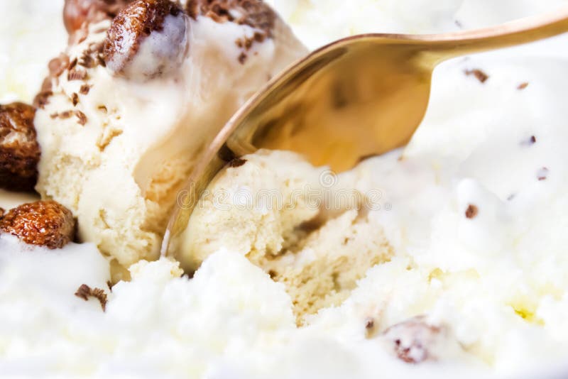 Vanilla Ice Cream with Chocolate and Crumbs with Copper Spoon. the ...