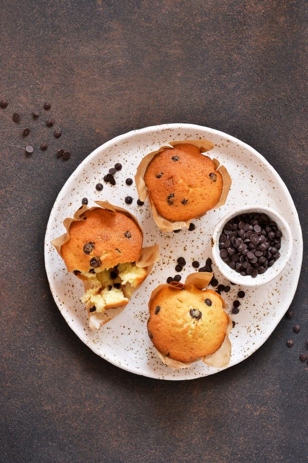 Vanilla Muffins in Paper Form with Chocolate Drops on a Concrete ...