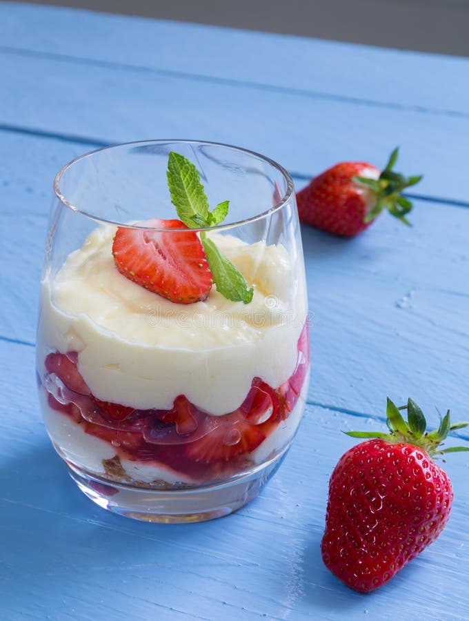 Vanilla Pudding with Tipsy Strawberries on Wood Stock Image - Image of ...