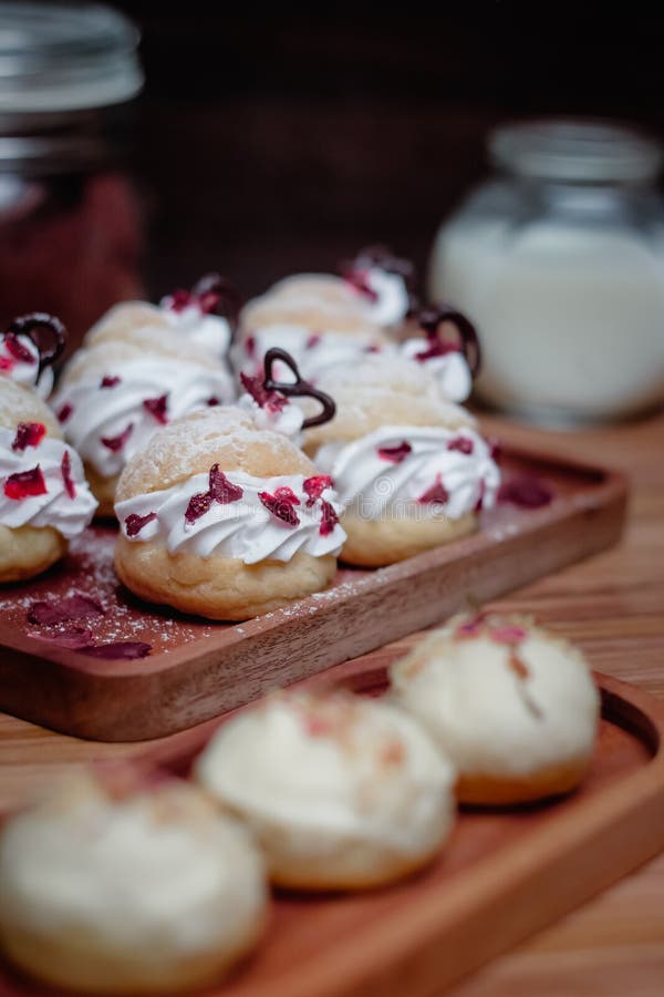 Vanilla Soes Cakes Served in Wood Plate on Table with Milk Stock Image ...
