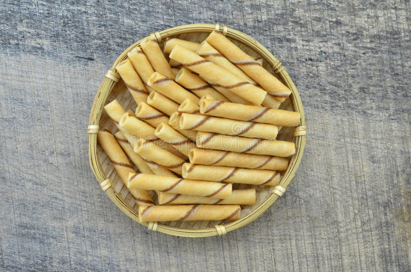 Vanilla Waffle Roll Sticks in Bamboo Basket on Table Stock Photo ...