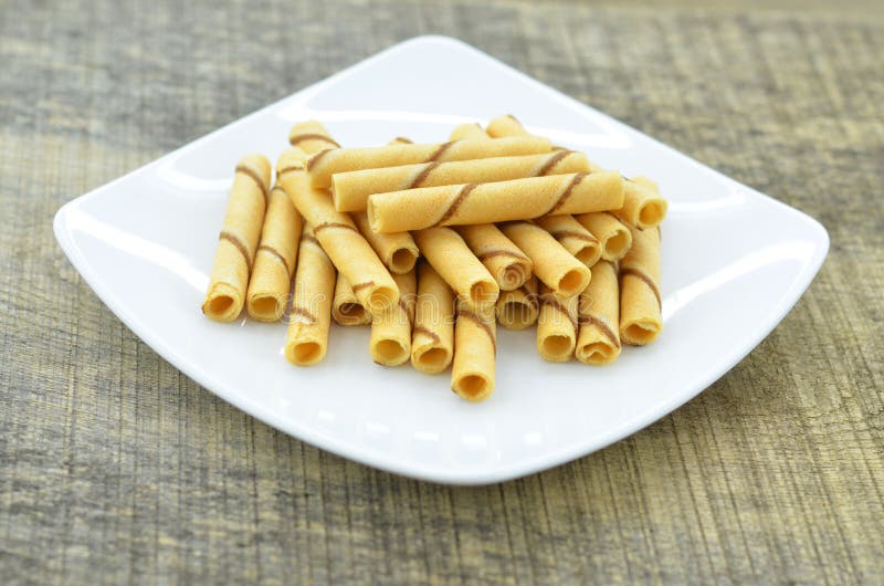 Vanilla Waffle Roll Sticks in White Plate Stock Image - Image of ...