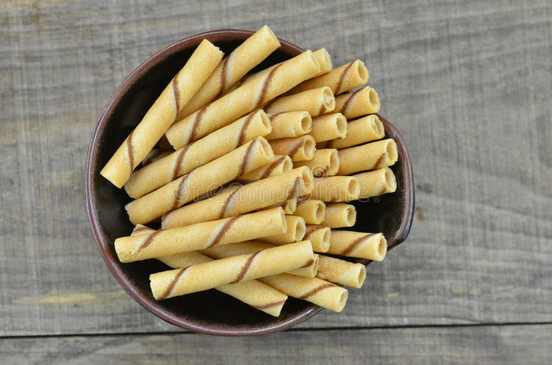 Vanillia Waffle Roll Stick in Black Ceramic Bowl Stock Image - Image of ...