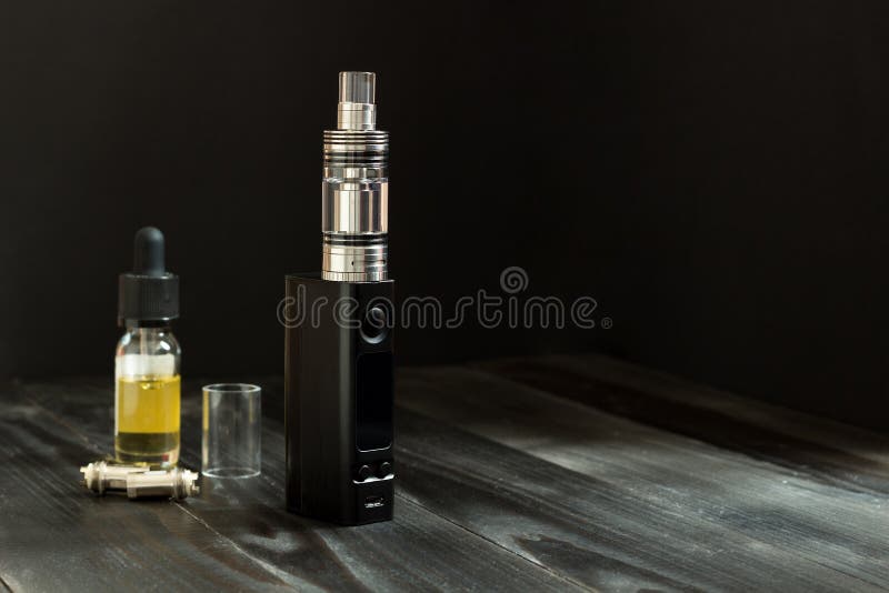 Vape or E-cigarette. Vaping Set on the Table. Stock Photo - Image of ...