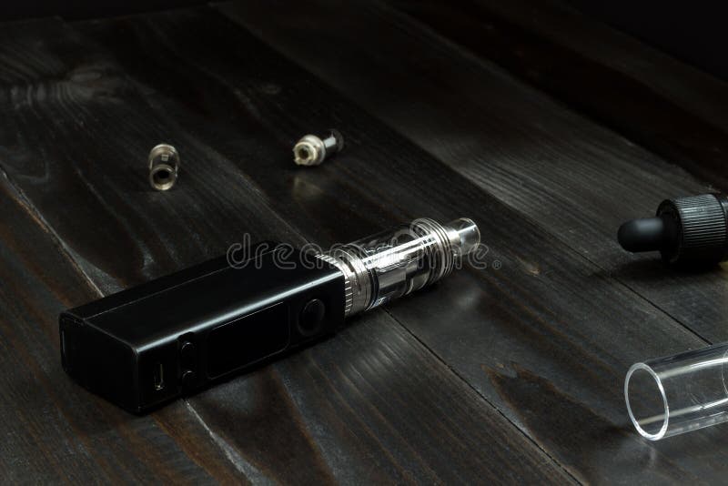 Vape or E-cigarette. Vaping Set on the Table. Stock Photo - Image of ...