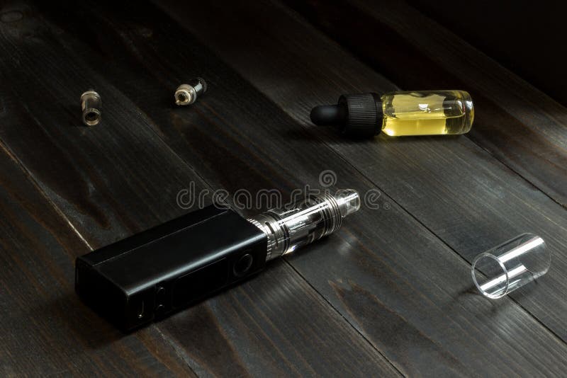 Vape or E-cigarette. Vaping Set on the Table. Stock Photo - Image of ...
