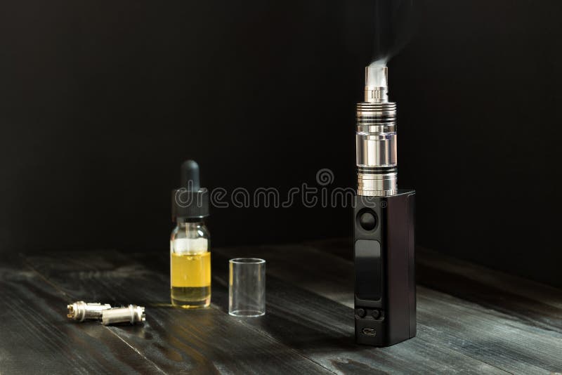 Vape or E-cigarette. Vaping Set on the Table. Stock Image - Image of ...