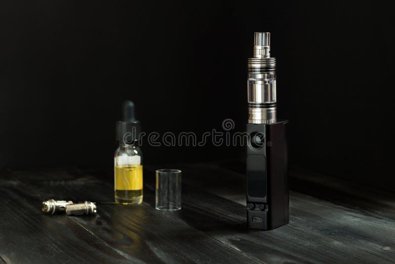 Vape or E-cigarette. Vaping Set on the Table. Stock Photo - Image of ...